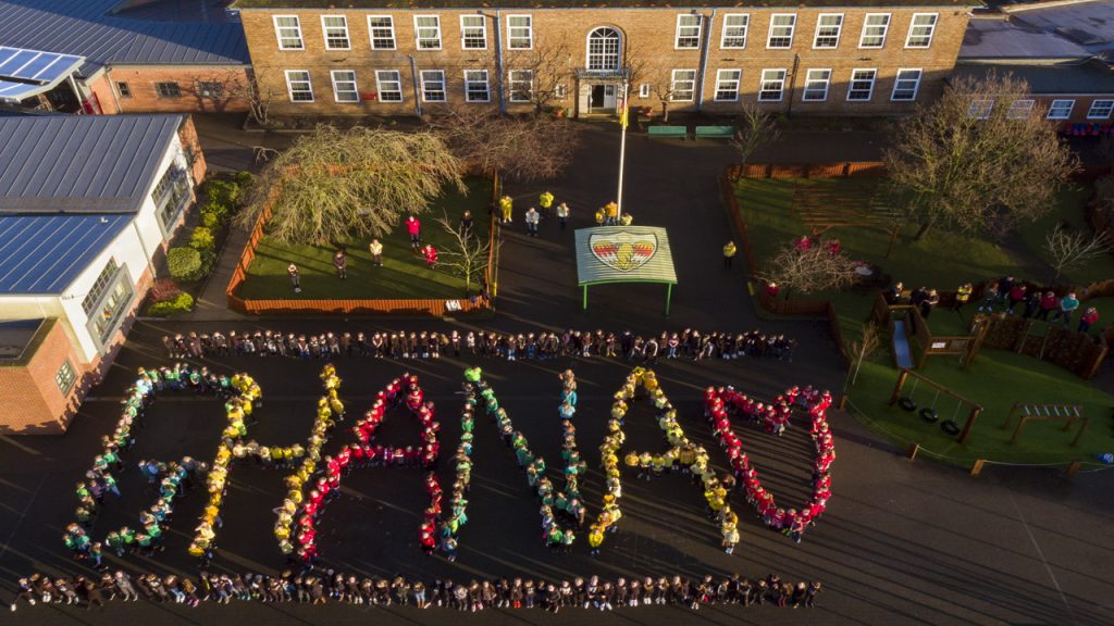 School Photographs - A view from above of buildings, facilities and pupils.